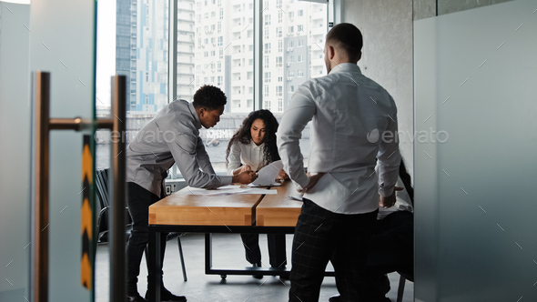 Back view businessman opening door to office walk into boardroom to ...