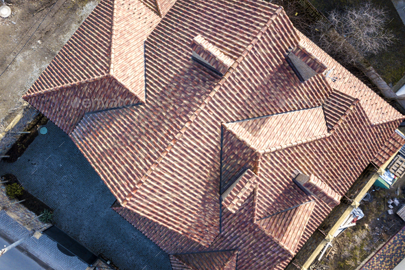 Top aerial view of building complex shingle roof construction. Abstract ...
