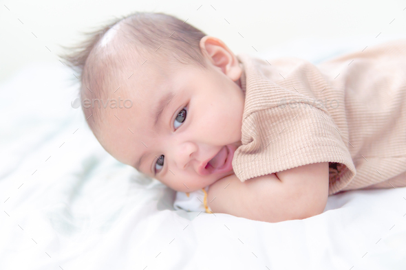 Cute little 3 month, and looking up in prone position, prone baby ...