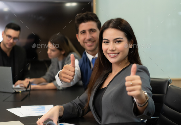 New business people in the conference room are exchanging information ...