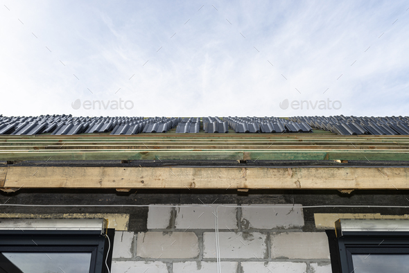 Roof ceramic tile arranged in packets on the roof on roof battens ...