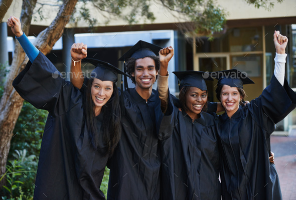 Nothing can stop us now. A group of smiling college graduates ...