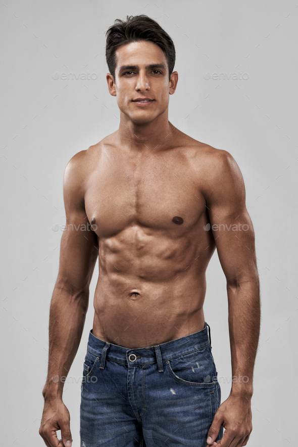 Hes got the perfect body. A handsome young shirtless man posing in ...