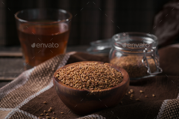 Bowl of fenugreek seeds and Egyptian fenugreek yellow tea or Methi Dana ...