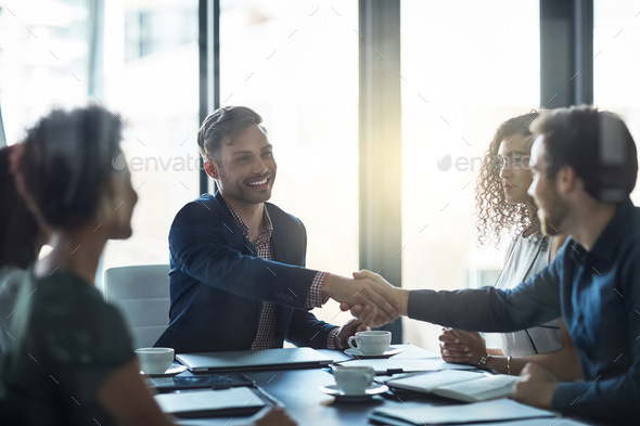 Welcome to our panel. Shot of a friendly businessman welcoming a new ...