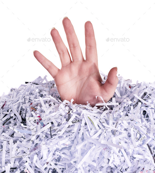 Drowning in destroyed documents Stock Photo by YuriArcursPeopleimages