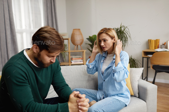 Couple Having Argument At Home. Angry Wife Shouting At Husband Of ...