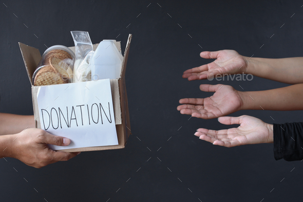 Hand giving box of various foods Stock Photo by Queenmoonlite35 | PhotoDune