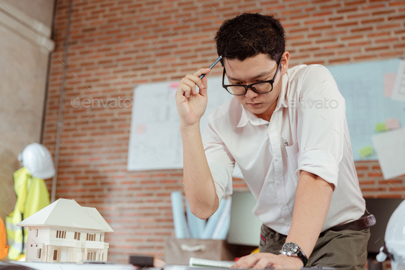 Male architect are using ideas for designing engineering or ...