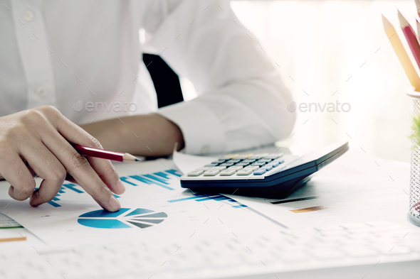 Accountant using a calculator to calculate the numbers. Accounting ...