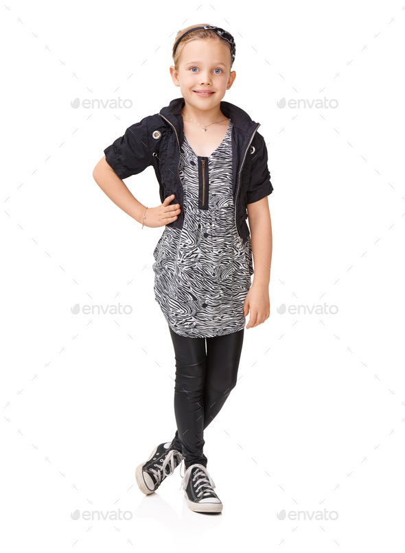 Shes a stylish young girl - Child fashion. A young girl posing in the ...