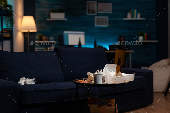 Empty living room space with leftovers stinky rubbish on table Stock ...