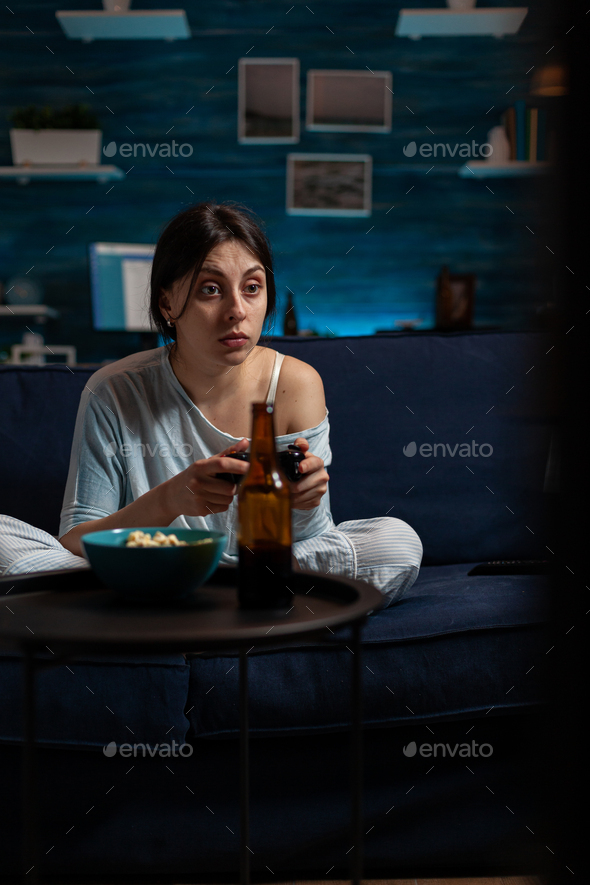 Focused person playing online video games on TV console Stock Photo by ...