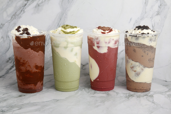Group of freshly made flavored frappe and shake Stock Photo by junpinzon