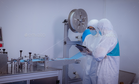 Technician worker wearing protective suite , glove are inspect ion with ...