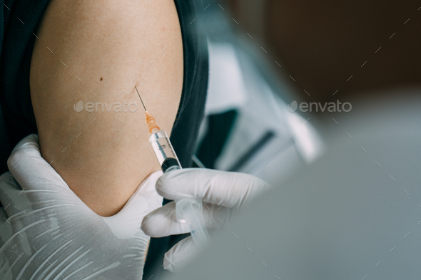 close up men doctor holding syringe and using cotton before make ...