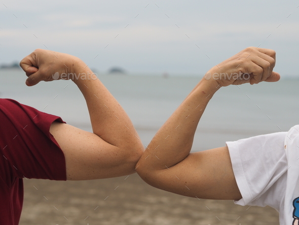 Two woman Alternative handshakes Elbow Bump greeting in the situation ...