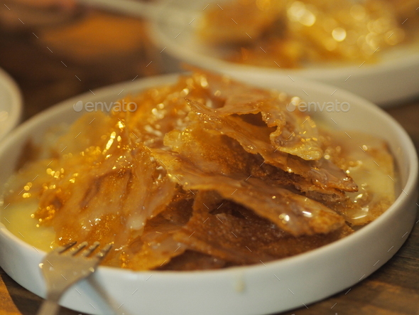 Crispy Roti with condensed milk in white dish, dessert snack sweet food ...