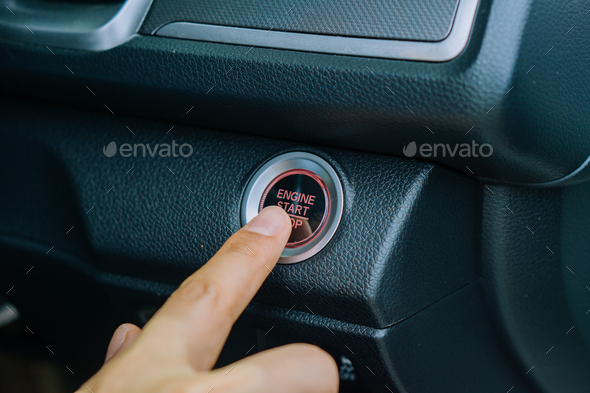 Car start stop system with finger pressing the button. Stock Photo by ...