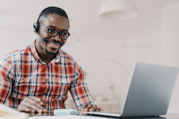 African american man support services technician in headset works at ...