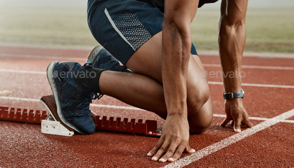 Time to turn into the flash. Shot of a male athlete waiting at the ...