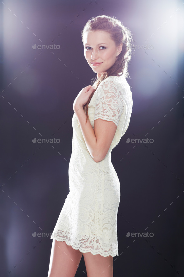 Everyone deserves to sparkle. A young elegant woman posing in a studio ...