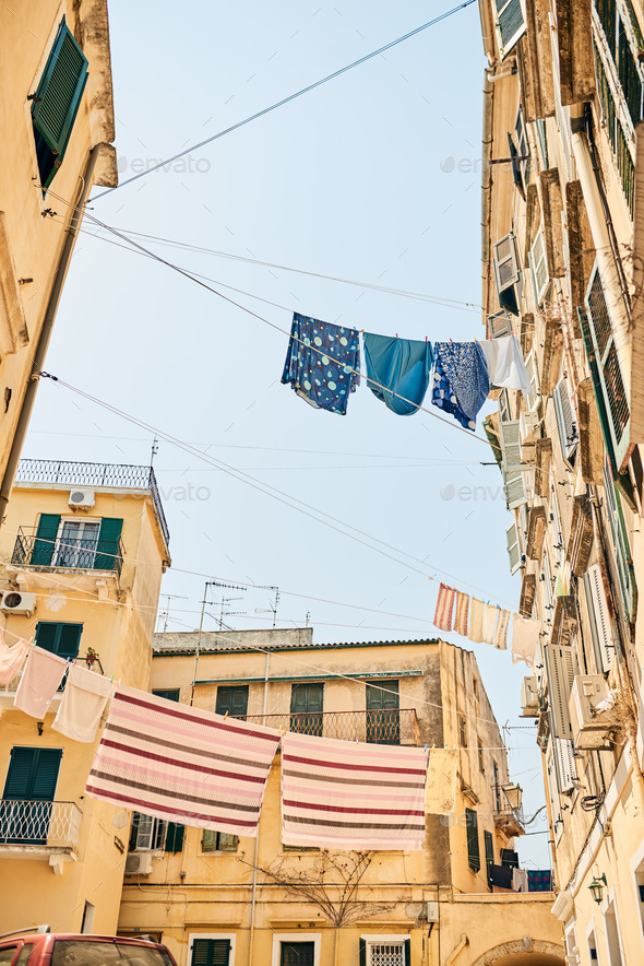 Low angle shot of clothing hanging from clothing lines between ...