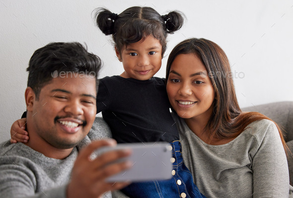 Shot of parents taking a selfie with their daughter Stock Photo by ...