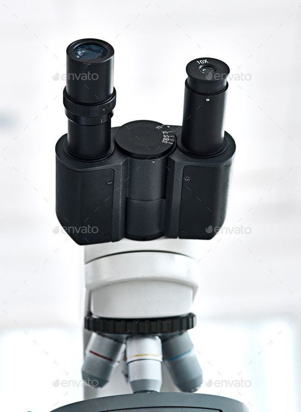 Still life shot of a microscope placed in a laboratory with its ...