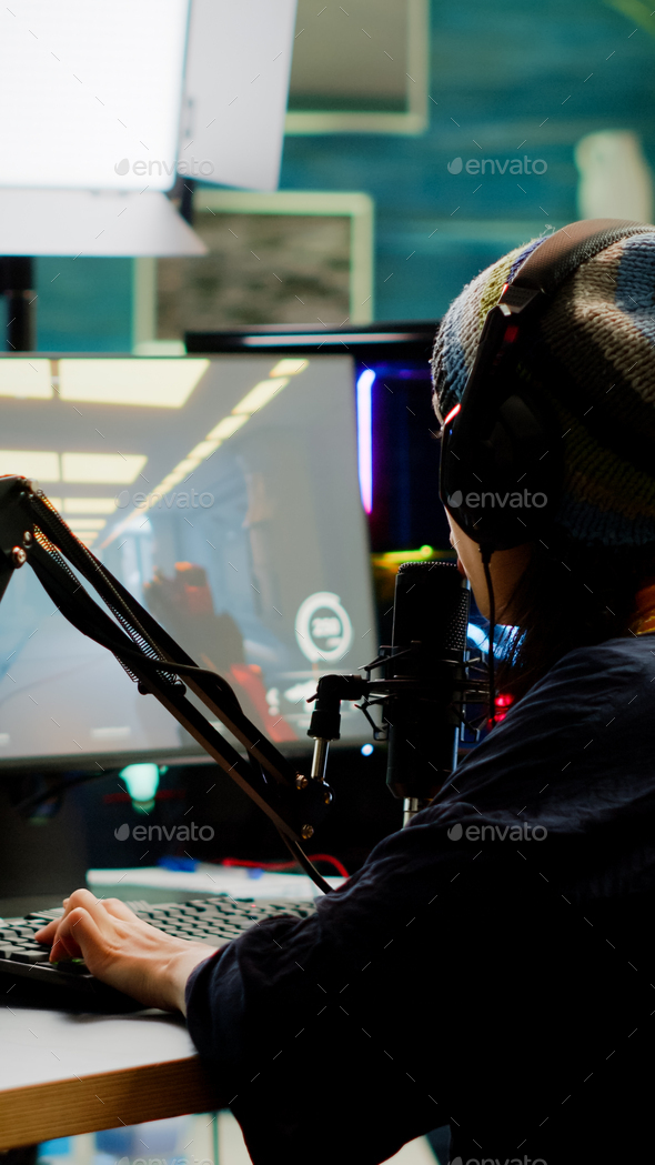 Pro streamer checking sound on mixer and putting on headset Stock Photo ...