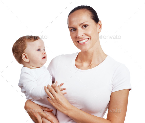 Safe in her mothers arms. An attractive young mom holding her baby ...