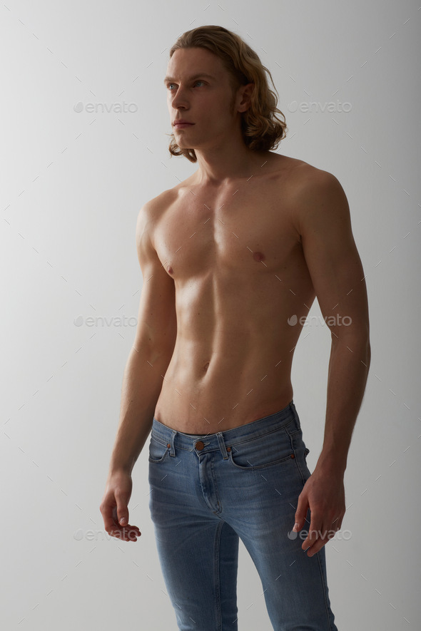 Shirtless style. Studio shot of a young man with a bare chest. Stock ...