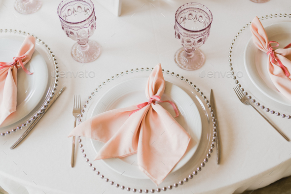 Table setting at the wedding reception. Laying and vintage plates on a ...