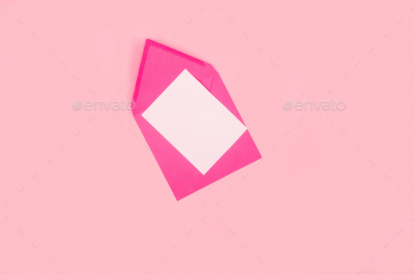 Open pink envelope with note paper card. Stock Photo by Viktoriyamart