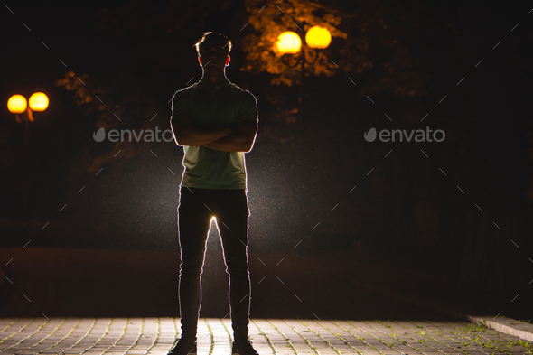 The man stand on the street. night time Stock Photo by artemp3 | PhotoDune