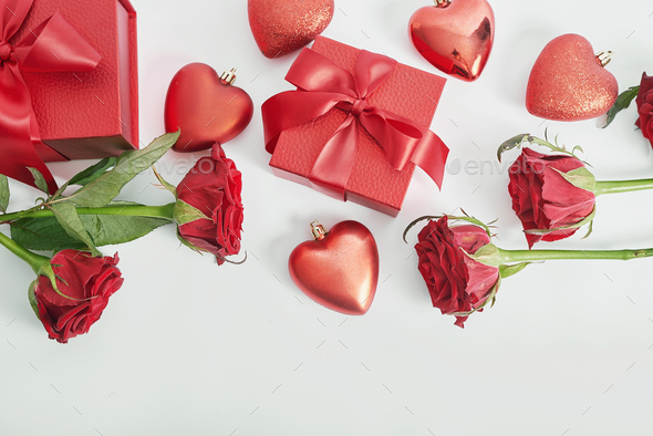 Valentine's day greeting card. Flowers and gifts boxes background ...