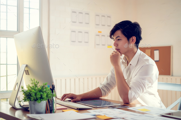 Designer man with computer and laptop planning application for mobile ...