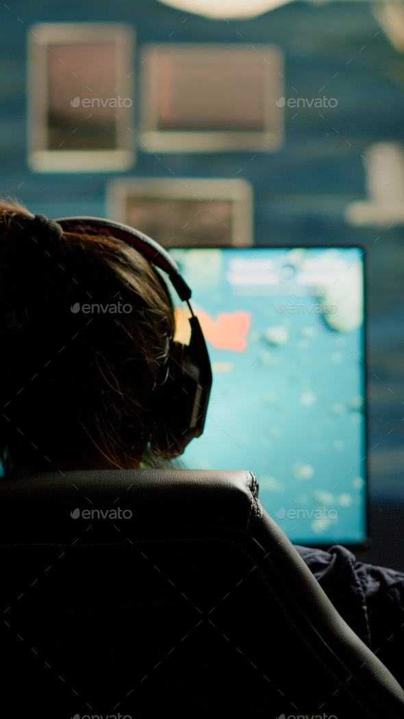 Pro gamer playing video game with new graphics winning championship ...