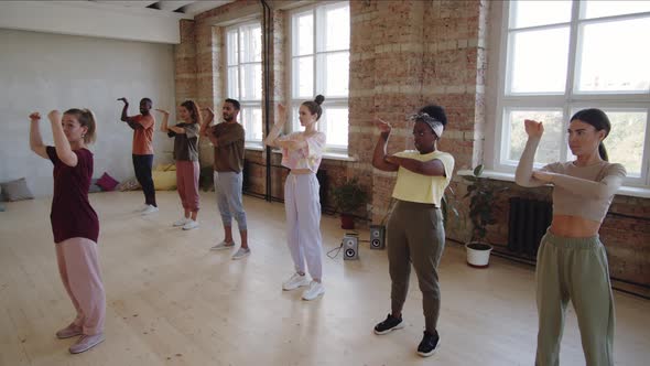 Dance Teacher Explaining Choreography to Diverse Students, Stock Footage