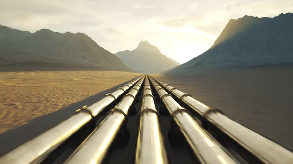 A pipeline running through the scenic desert during beautiful sunset ...