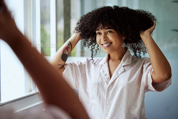 Beauty, hair and mirror with a black woman in the bathroom of her home ...