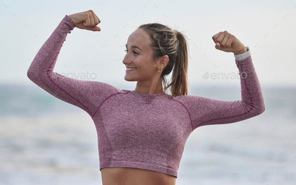 Strong, fitness and woman with muscle flex, exercise on beach and ...