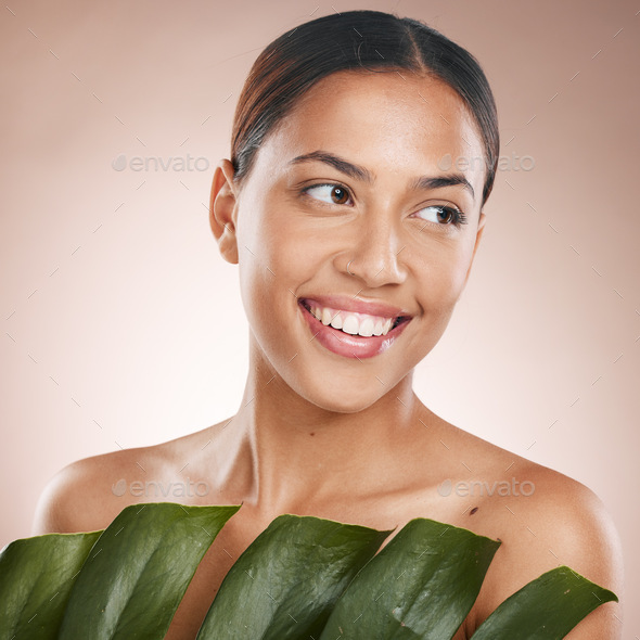 Woman, face skincare and monstera leaf on pink studio background for ...