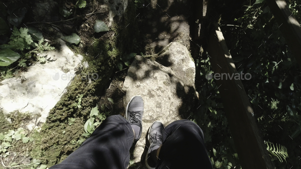 Top view of male legs moving down the countryside forest trail. Clip ...