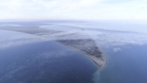 Top view of coast among sea on background of sky horizon. Shot. The ...