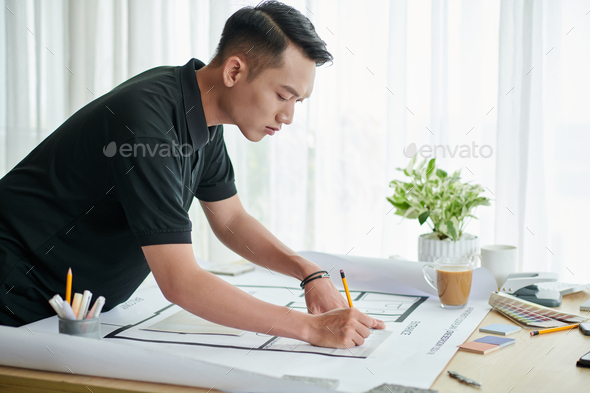 Architect Writing on Blueprint Stock Photo by DragonImages | PhotoDune