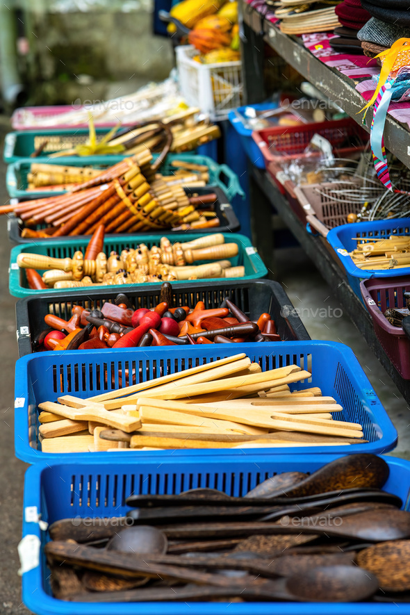 Wooden kitchen utensils in the basket for sale at the market in ...