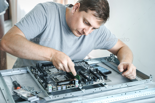 Man engineer,collector.Independent self computer assembly. Mounting in sockets processor,random ...