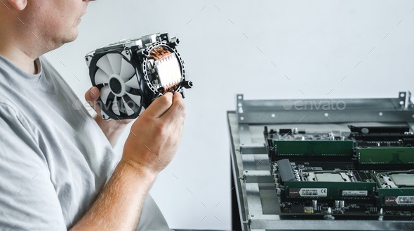 Man engineer,collector.Independent self computer assembly. Mounting in sockets processor,random ...