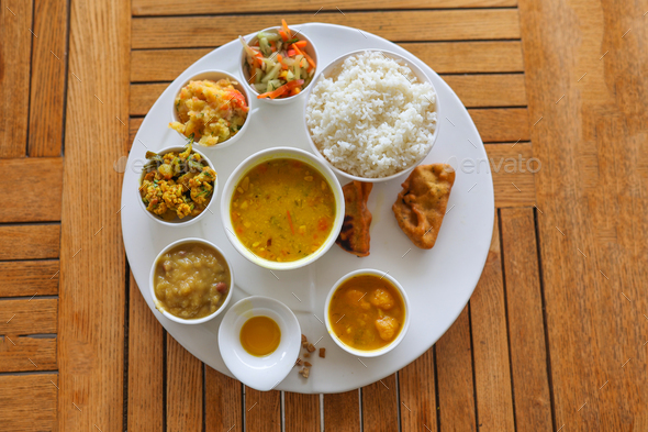 Best assamese thali in kazirang Stock Photo by wirestock | PhotoDune